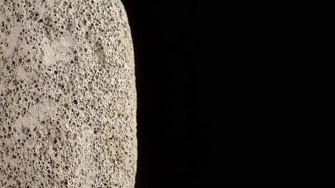 Scoria magma rock close up isolated agai... | Stock Video | Pond5