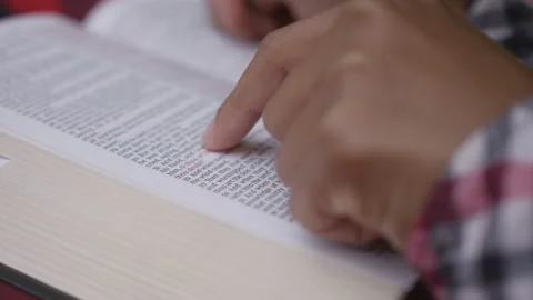 Scrolling Finger Follows Words On Page | Stock Video | Pond5