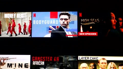 scrolling a television screen with Netfl... | Stock Video | Pond5