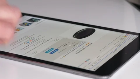 Scrolling on touchscreen and shopping on... | Stock Video | Pond5
