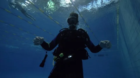 Scuba dive instructor showing hand gestu... | Stock Video | Pond5