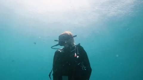 Scuba Diver Ascending to Surface with Bu... | Stock Video | Pond5