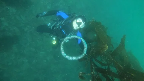 Scuba Diver Shapes Bubble Rings | Stock Video | Pond5