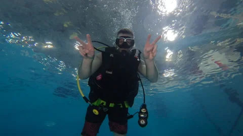 scuba diver training in pool gives peace... | Stock Video | Pond5