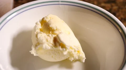 Scuba vanilla ice cream falling slowly a... | Stock Video | Pond5
