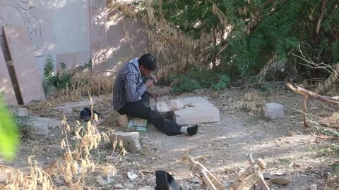 A sculptor is making an idol of God from... | Stock Video | Pond5