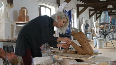 Sculptress Sculptor is sculpting realist... | Stock Video | Pond5