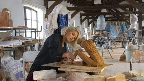 Sculptress Sculptor is sculpting realist... | Stock Video | Pond5