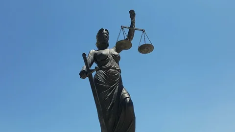 Sculpture of Themis on blue background | Stock Video | Pond5