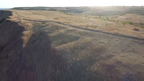 Sea and high shore at sunset. Trees and ... | Stock Video | Pond5