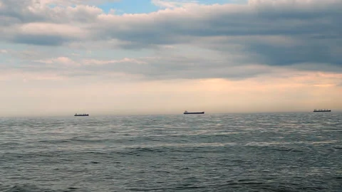 Sea, big dark rain clouds on sky, grain ... | Stock Video | Pond5