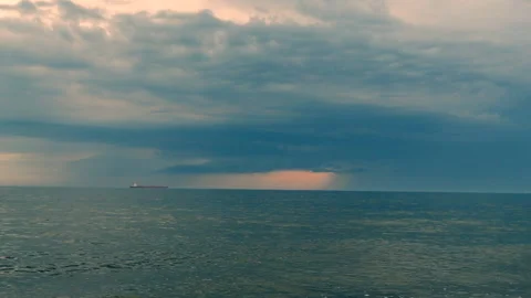Sea, big dark rain clouds on sky, grain ... | Stock Video | Pond5
