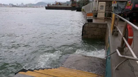 Sea currents splash water at the harbor ... | Stock Video | Pond5