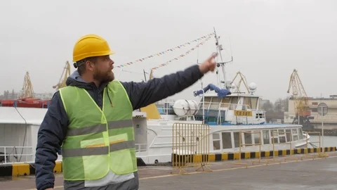 sea port worker with a beard and a helme... | Stock Video | Pond5