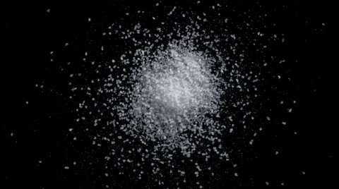 Sea salt exploding against black backgro... | Stock Video | Pond5