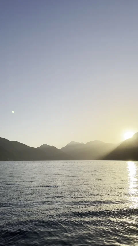 Sea surf against the backdrop of a high ... | Stock Video | Pond5