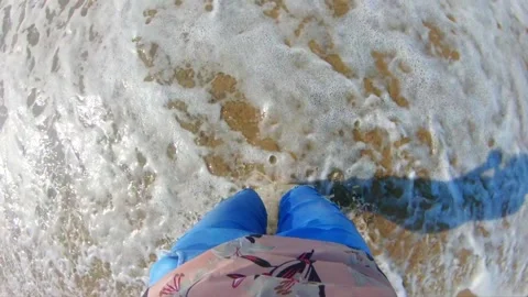 Sea waves washing over female feet, Youn... | Stock Video | Pond5