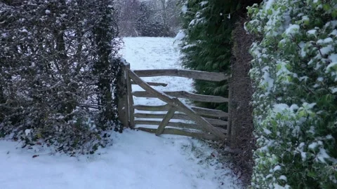 Seamless loop of Snow in front of a gate... | Stock Video | Pond5