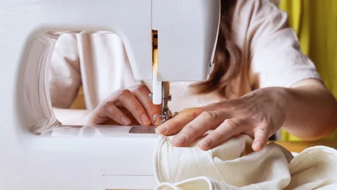 Seamstress sewing linen fabric on sewing... | Stock Video | Pond5