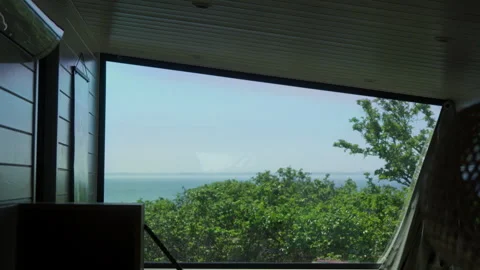 Seaside Serenity: View from Window of Ti... | Stock Video | Pond5