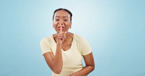 Secret, finger to lips and black woman w... | Stock Video | Pond5