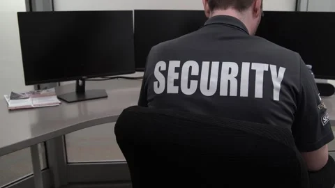 Security guard doing admin tasks at nigh... | Stock Video | Pond5