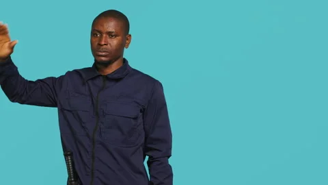 Security guard doing salute hand gesture... | Stock Video | Pond5