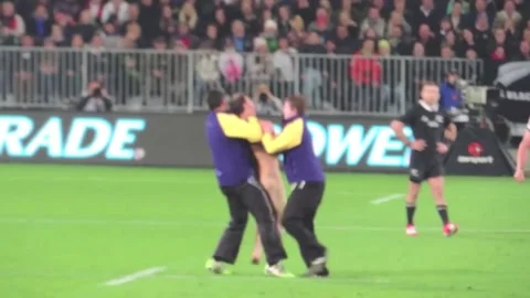 Security guard tackles streaker at All B... | Stock Video | Pond5