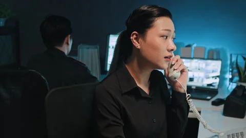 Security Guard Talking on Landline Phone... | Stock Video | Pond5