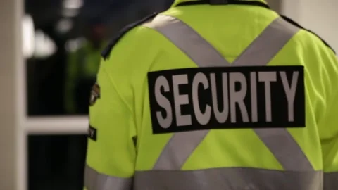 Security guard is watching over city lig... | Stock Video | Pond5