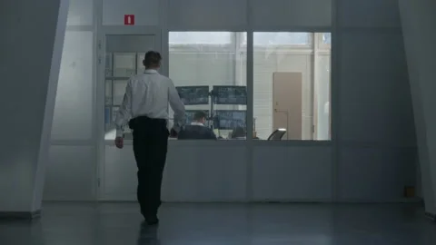 Security officer comes in observation ro... | Stock Video | Pond5