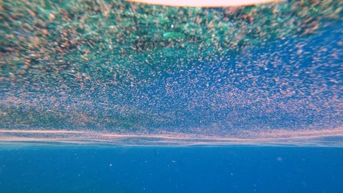 Sediment floating on polluted ocean surf... | Stock Video | Pond5