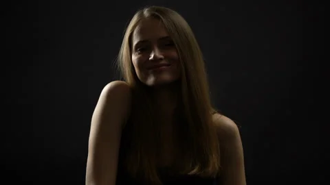 Seductive female dancing against dark ba... | Stock Video | Pond5