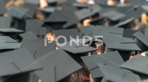 A see of graduation caps at a graduation ceremony Stock Image #125824776