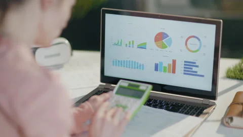 Seen from behind modern female with calc... | Stock Video | Pond5