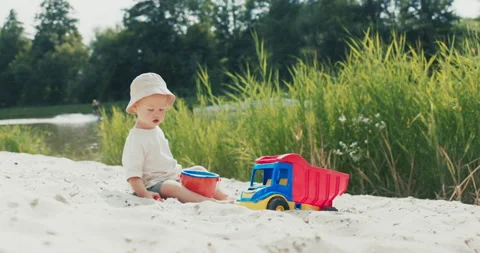 Self-contained little boy is playing in ... | Stock Video | Pond5