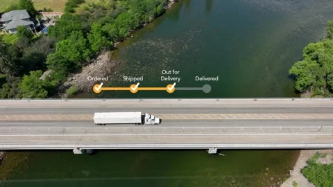 Semi truck driving across bridge with an... | Stock Video | Pond5