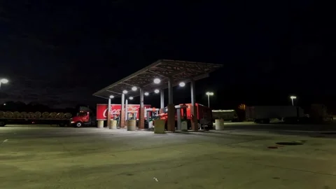 Semi truck passes at night at Sprint Gas... | Stock Video | Pond5