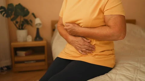 Senior 60s 70s woman suffering stomach p... | Stock Video | Pond5
