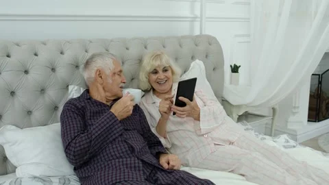 Senior elderly couple wearing pyjamas ly... | Stock Video | Pond5