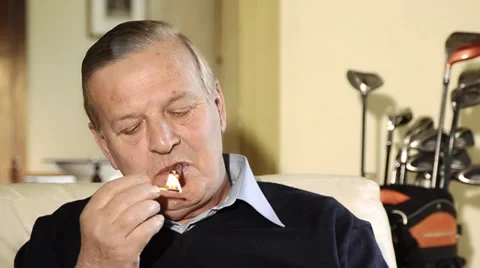 Man Smoking Cigar Stock Video Footage | Royalty Free Man Smoking Cigar Videos | Pond5