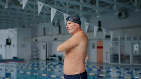Senior man swimmer doing warming up exer... | Stock Video | Pond5