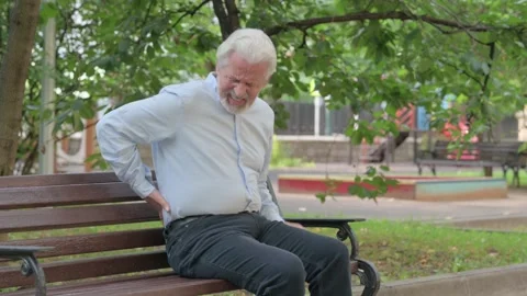 Senior Old Man Sitting Outdoor with Back... | Stock Video | Pond5