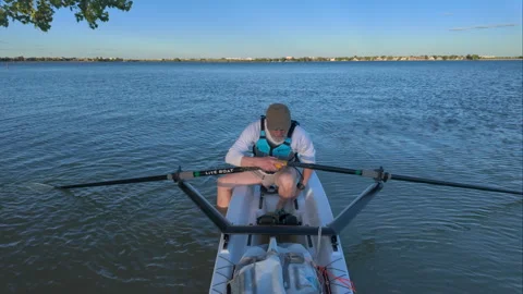 Senior rower is boarding his coastal row... | Stock Video | Pond5