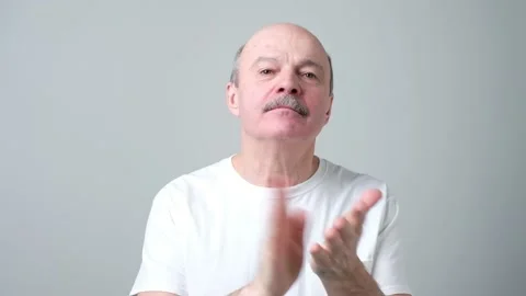Senior sad man clapping hands with disap... | Stock Video | Pond5