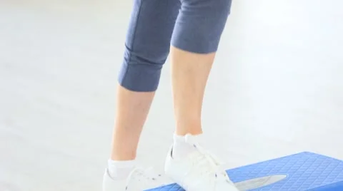 Senior woman doing step exercises in fit... | Stock Video | Pond5