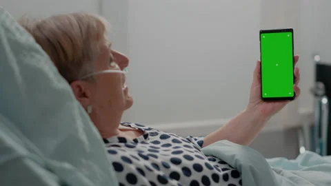 Senior woman looking at green screen on ... | Stock Video | Pond5