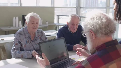 Seniors learning technology in community... | Stock Video | Pond5