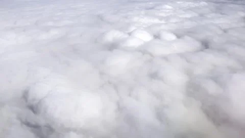 A serene view of a dense layer of fluffy... | Stock Video | Pond5