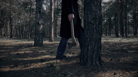 Serial killer with axe wants to commit t... | Stock Video | Pond5